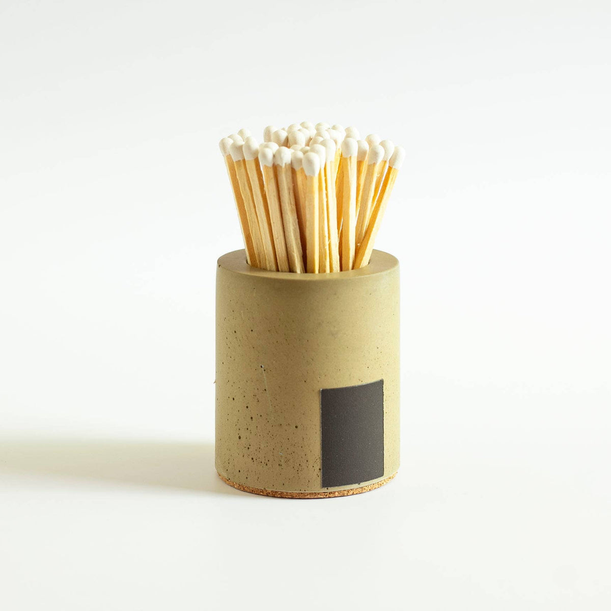 The Taupe Cylinder Match Holder | Adobe by Jess Vargas