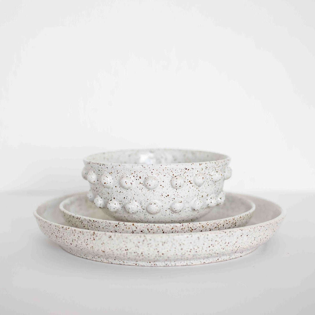 White Ceramic Plate with Volcanic Stone | Adobe by Jess Vargas